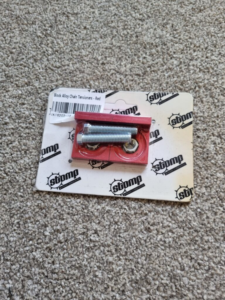 Stomp red chain adjuster blocks - Motosyko Mini Bike Specialists